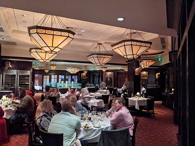 Where culinary magic happens – the art-deco chandeliers casting a glow that makes everyone look like they've just closed a successful business deal.