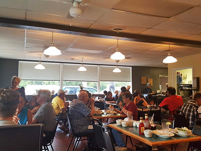 The counter seats offer front-row tickets to the breakfast show – where coffee flows freely and regulars exchange morning pleasantries.