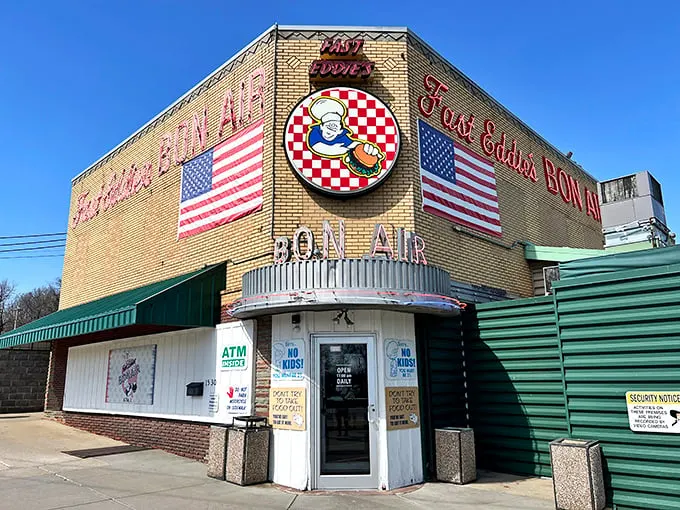 Fast Eddie's Bon-Air—where American flags fly proudly and legendary budget-friendly burgers have satisfied hungry visitors for generations without inflation-adjustment.