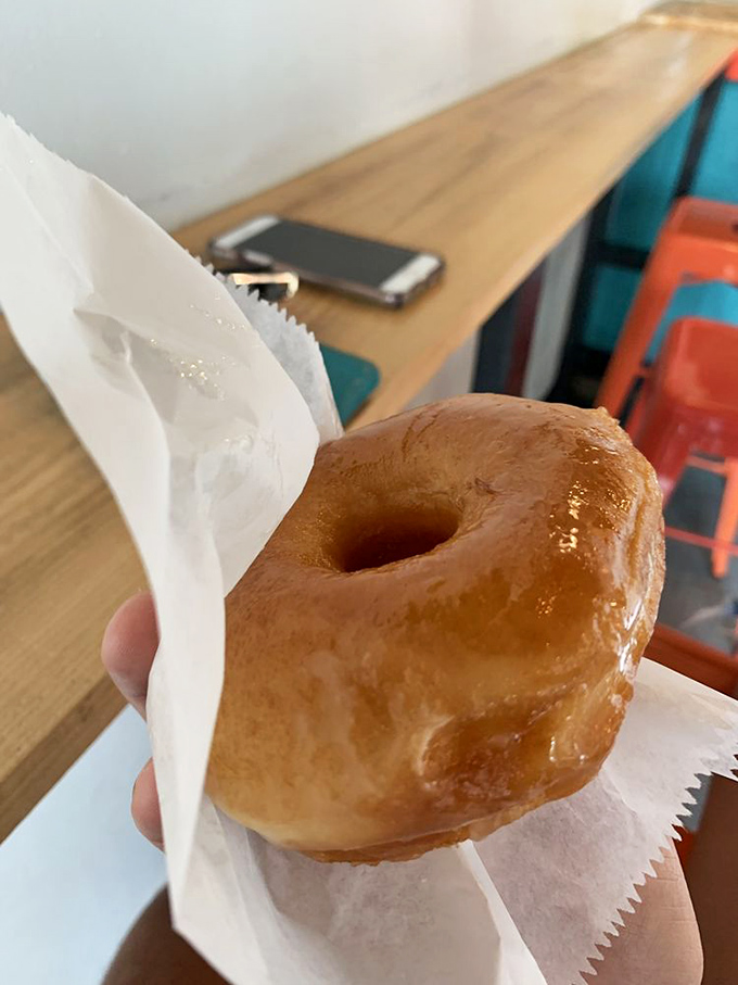 The humble glazed donut—perfectly bronzed and glistening—reminds us that sometimes the classics become classics for very good reasons.