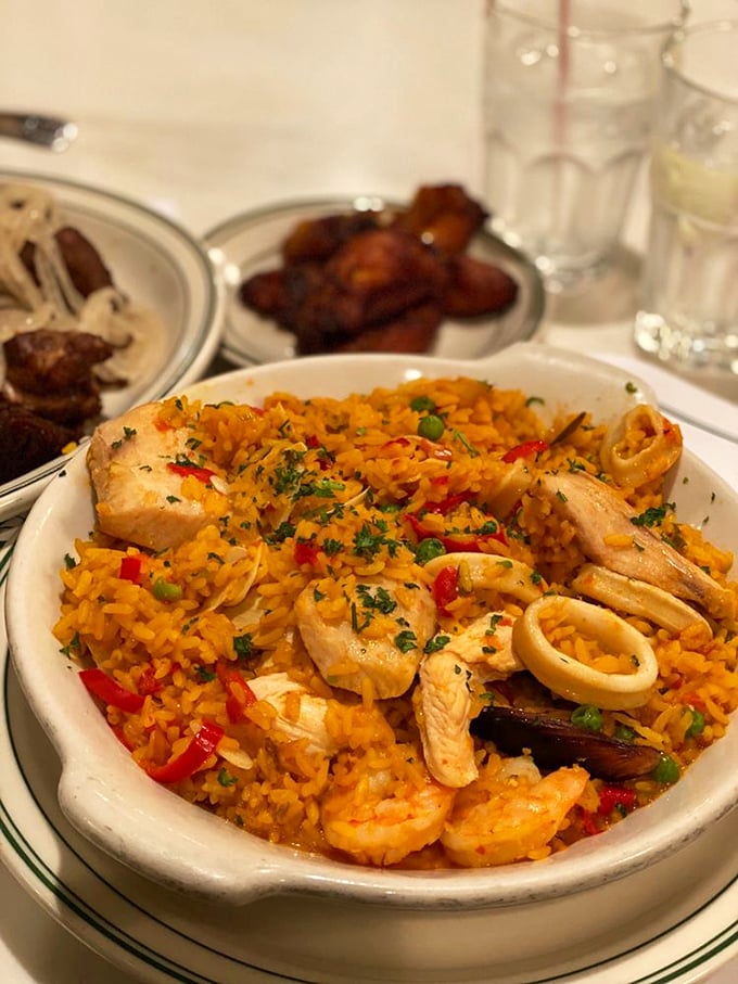 This paella isn't just dinner—it's a colorful fiesta where seafood, chicken, and saffron rice have gathered to celebrate in your mouth.