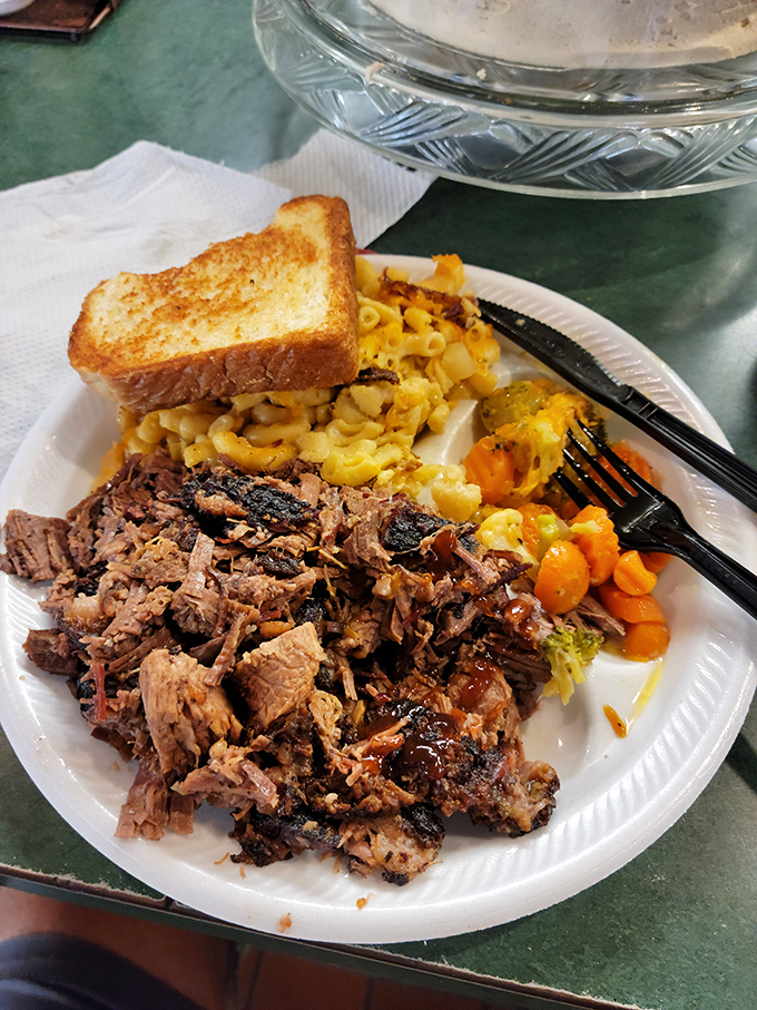 This isn't just pulled pork—it's a Southern sermon on a plate, with mac and cheese and carrots as the choir. Hallelujah!