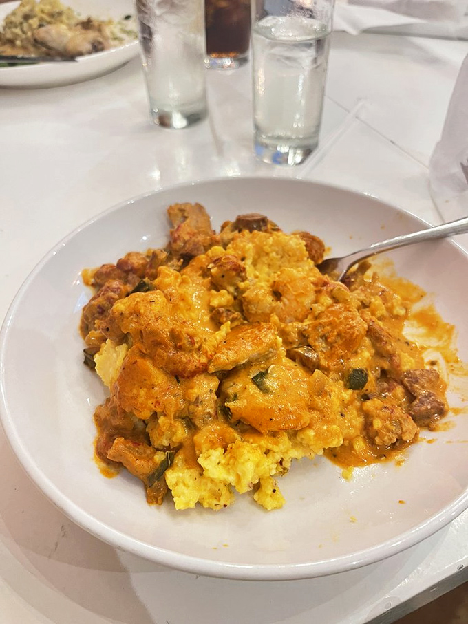 Swamp Grits elevate humble cornmeal to art form status—spicy, savory, and so satisfying you'll forget you once thought grits were boring.
