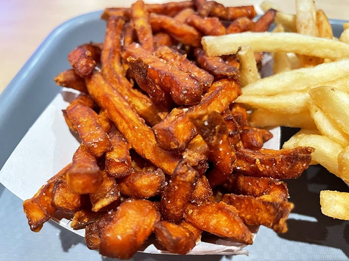 These sweet potato fries have that perfect outer crunch giving way to a pillowy interior—the culinary equivalent of crisp sheets at a luxury hotel.