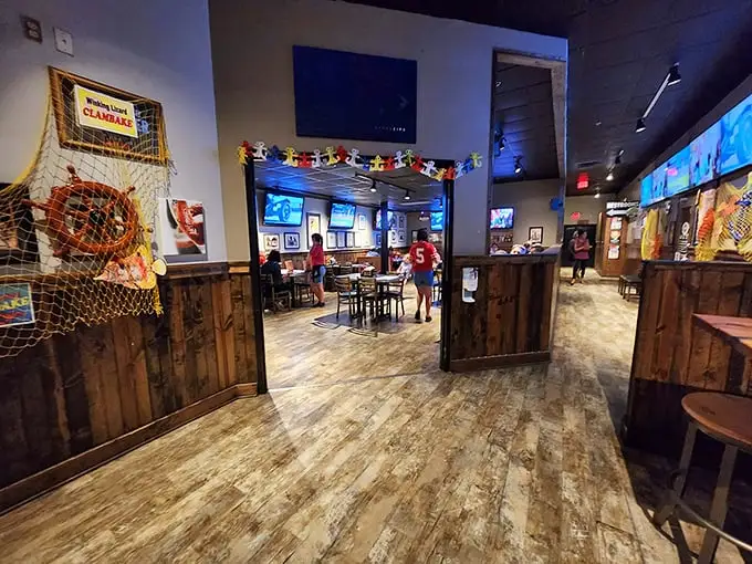 Rustic wood meets sports bar energy in a space that feels like your favorite uncle's basement—if your uncle were a hospitality genius.