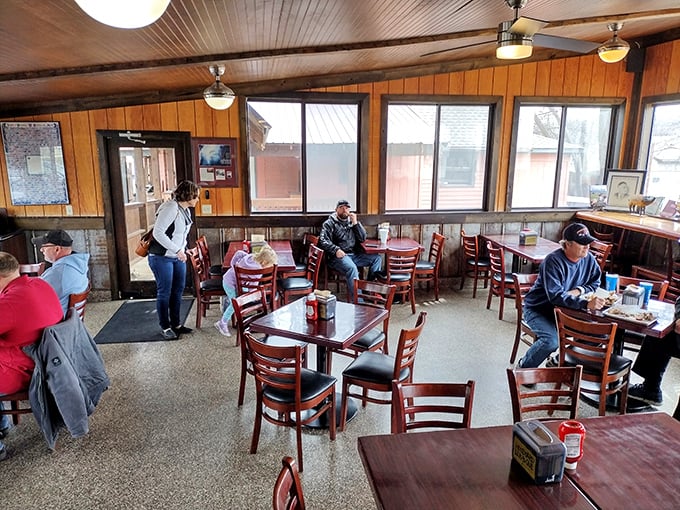 Where strangers become friends over shared barbecue enthusiasm. These diners aren't just eating lunch—they're participating in a Kansas City tradition.
