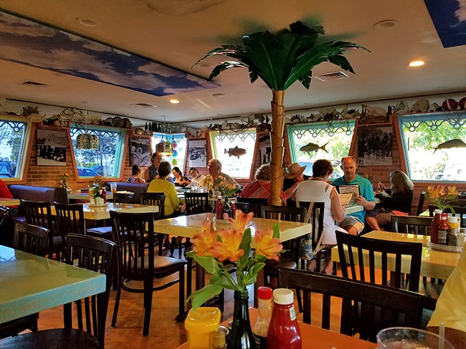 Where strangers become friends over seafood. That flower centerpiece is just showing off—the real color comes from the characters who dine here.