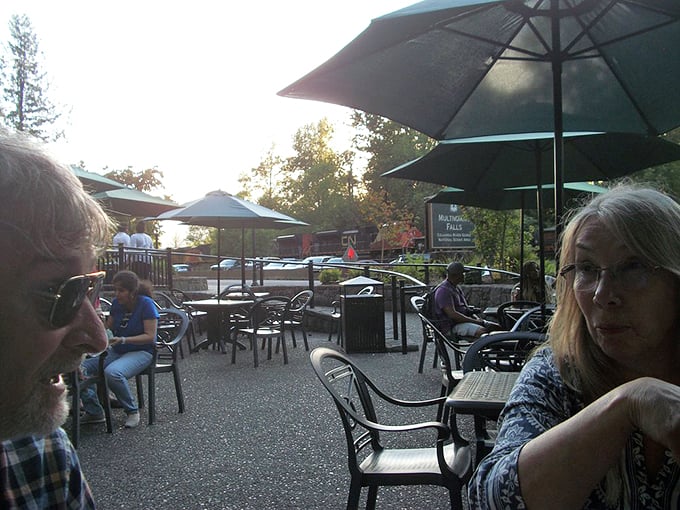 The outdoor dining area at Multnomah Falls Lodge – where sandwiches taste better because you're eating them in the presence of geological greatness. 