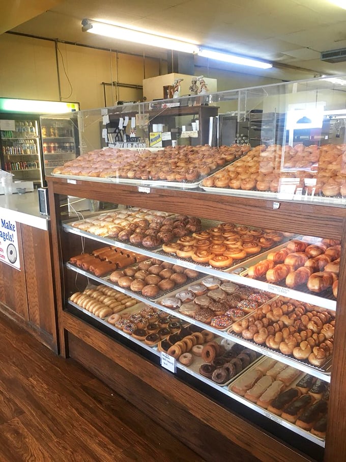 Donut display cases that could make a cardiologist weep and a child rejoice – sometimes the simple pleasures are worth every calorie.
