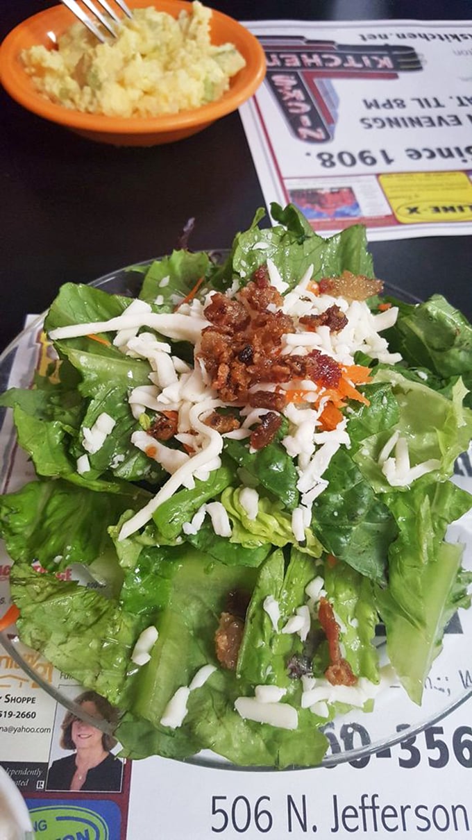 A garden-fresh salad topped with cheese and bacon bits—because sometimes virtuous eating deserves a little rebellion.