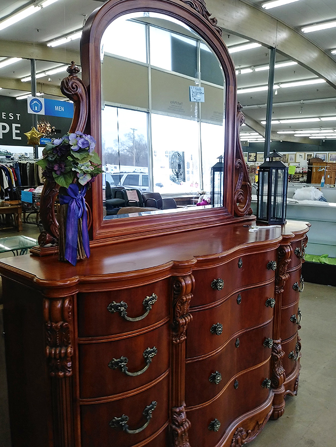 This magnificent dresser with ornate mirror isn't just furniture—it's a time machine to an era when craftsmanship was an art form. 