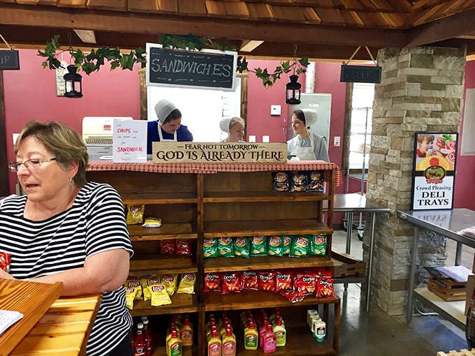 Behind every great sandwich is a team that understands the art of simplicity. Note the inspirational sign—they're feeding souls as well as bodies.