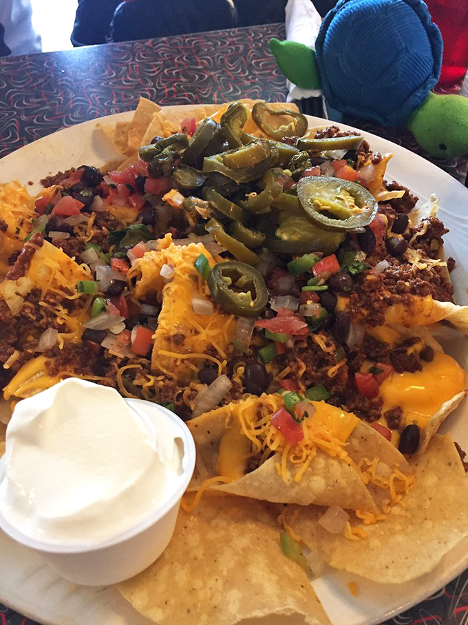 These nachos aren't just a dish—they're a fiesta on a plate. Every bite is like a tiny celebration in your mouth.