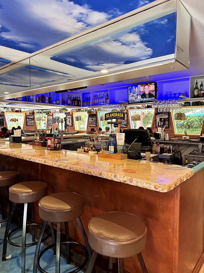 The bar where Keys tales grow taller with each round. Notice that sky ceiling—because even indoors, you're still in paradise.