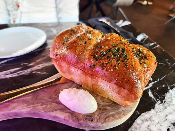 Garlic bread elevated to art form—this golden loaf isn't just a prelude to dinner, it's a statement piece worthy of its own spotlight.