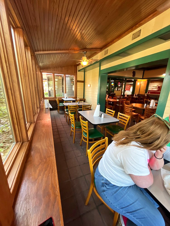 The dining room's warm wooden ceiling and ample windows create that "stay awhile" vibe that turns first-timers into regulars.