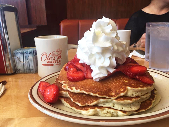 Pancakes stacked higher than your weekend expectations, with berries and cream that turn breakfast into an event worth traveling for. Photo