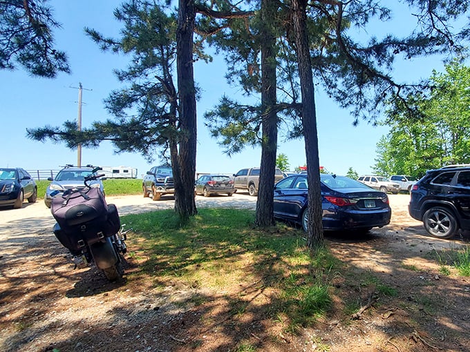 The journey to natural wonder begins here – a humble parking area serving as the gateway between ordinary life and extraordinary adventure.