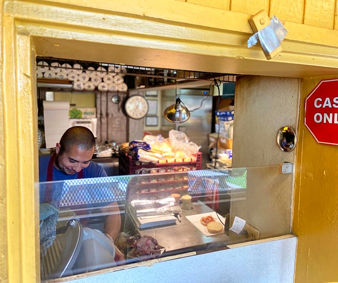 A glimpse into the inner sanctum where magic happens. That focused expression is the look of someone who takes meat very seriously.
