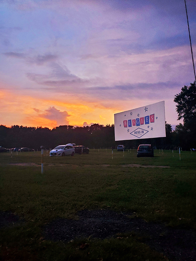 That sunset behind the screen isn't just pretty—it's nature's own opening act, setting the stage for the cinematic magic about to unfold.