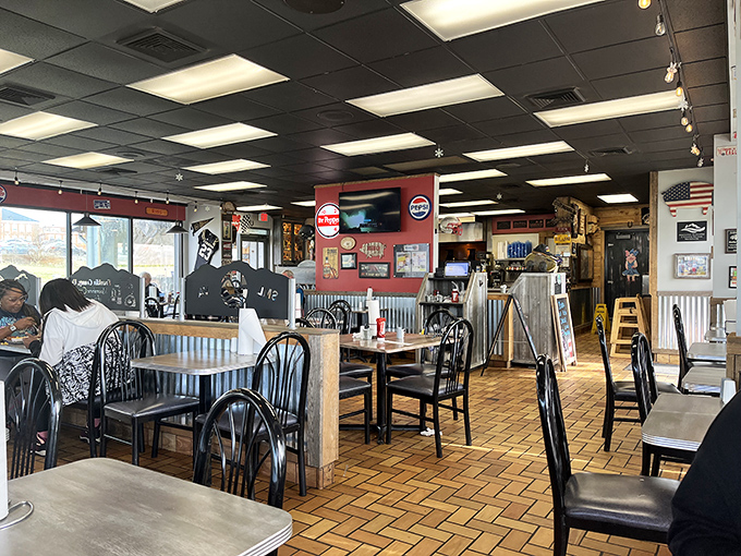 Red walls, wooden tables, and the promise of barbecue. Sometimes the simplest dining rooms hold the most complex flavors.