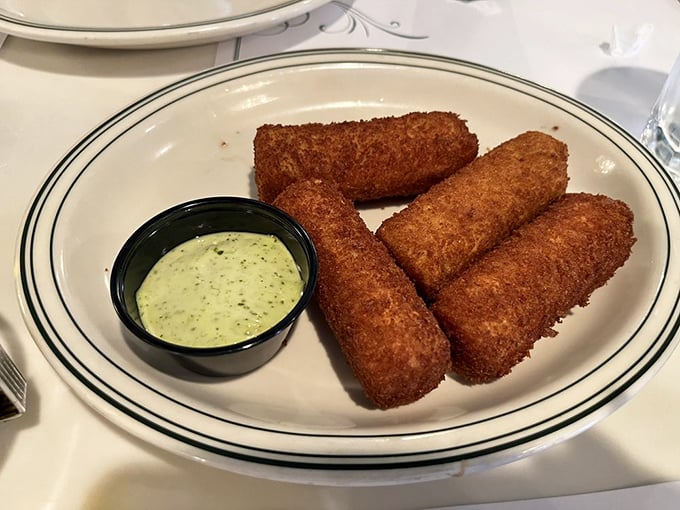 Croquetas—the Cuban answer to "What if we made happiness bite-sized?" Crispy outside, creamy inside, and utterly impossible to eat just one.