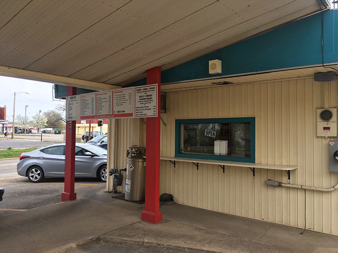 The drive-in window – where car culture meets culinary tradition in a beautiful dance that's been choreographed since the Truman administration.