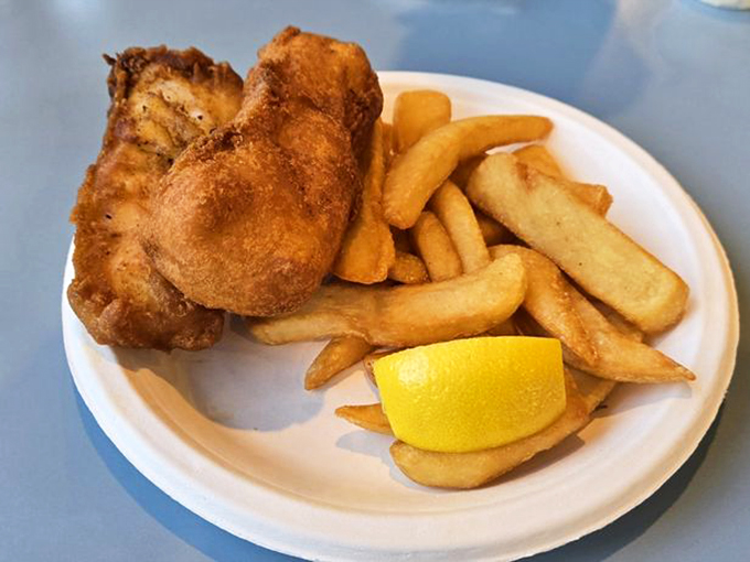 Classic fish and chips that would make a British pub jealous. That lemon wedge isn't decoration—it's the finishing touch on perfection.