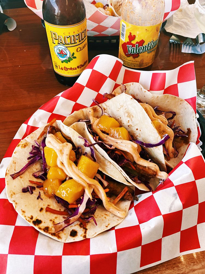 Tacos that tell tales of two worlds colliding deliciously. The mango adds a sweet plot twist to this handheld seafood story.
