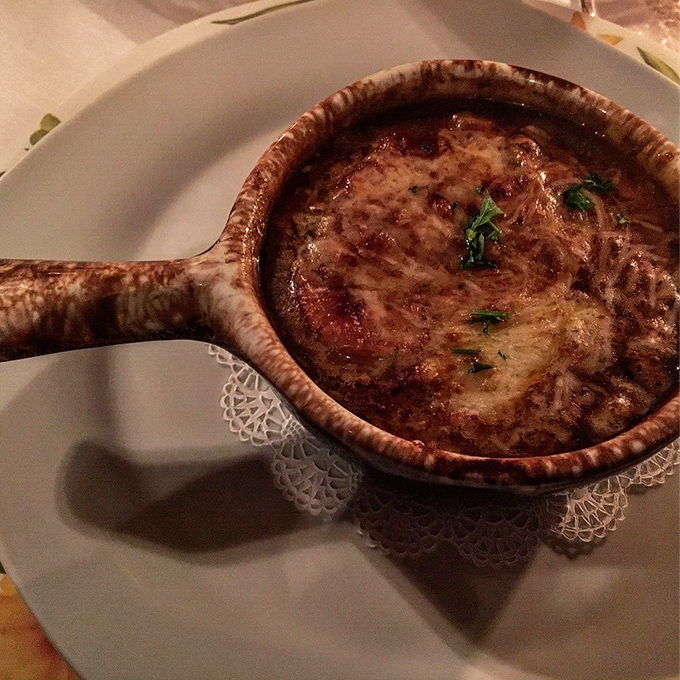 French onion soup that's worth the inevitable cheese pull photo-op—a bubbling cauldron of comfort that soothes the soul. 
