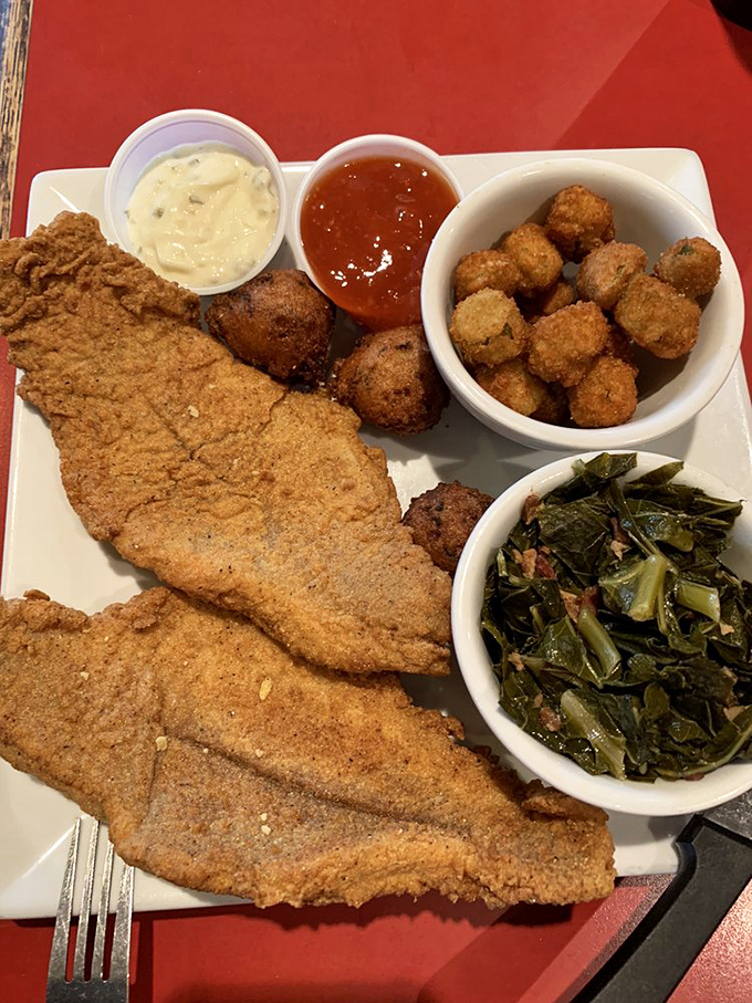 This isn't just fried catfish—it's a masterclass in Southern cooking with collard greens and hush puppies playing perfect supporting roles.