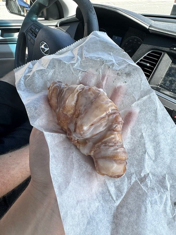 This glazed croissant is what happens when French technique meets American indulgence—a flaky, buttery marvel that's worth every crumb on your shirt.