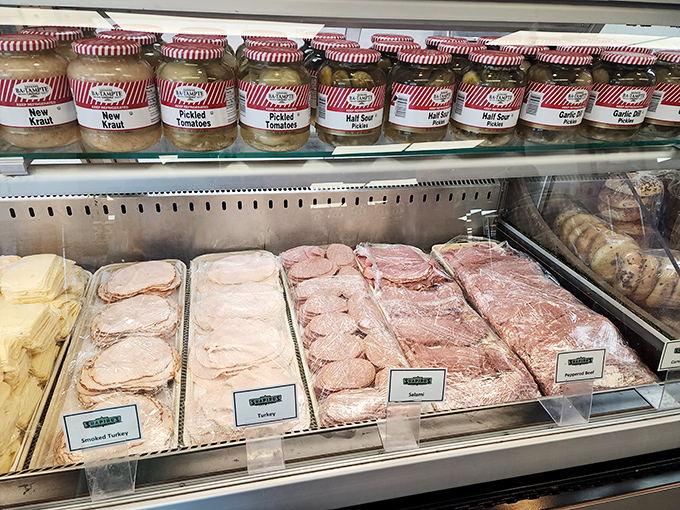 The deli case—a museum of meats where turkey, pastrami, and corned beef wait patiently for their moment of sandwich glory.