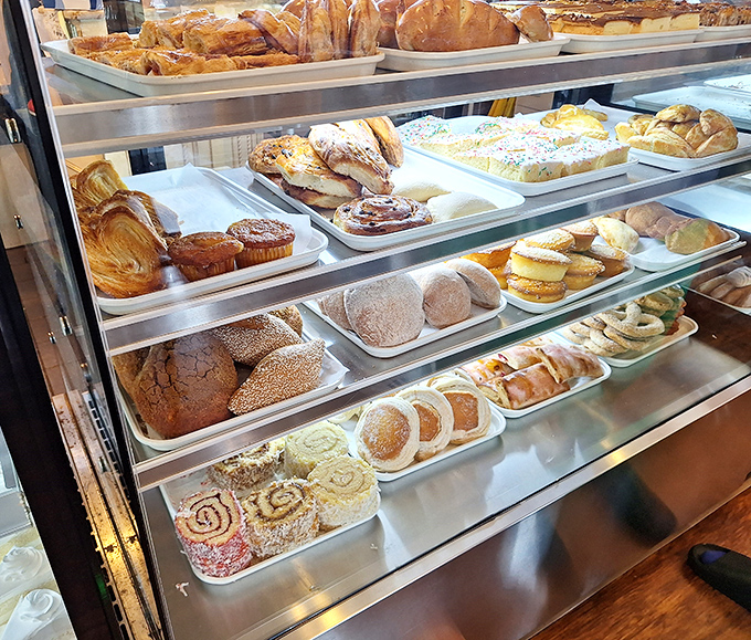 The pastry case at La Mascota isn't just a display – it's a museum of carbohydrate artistry where everything is begging to be taken home.