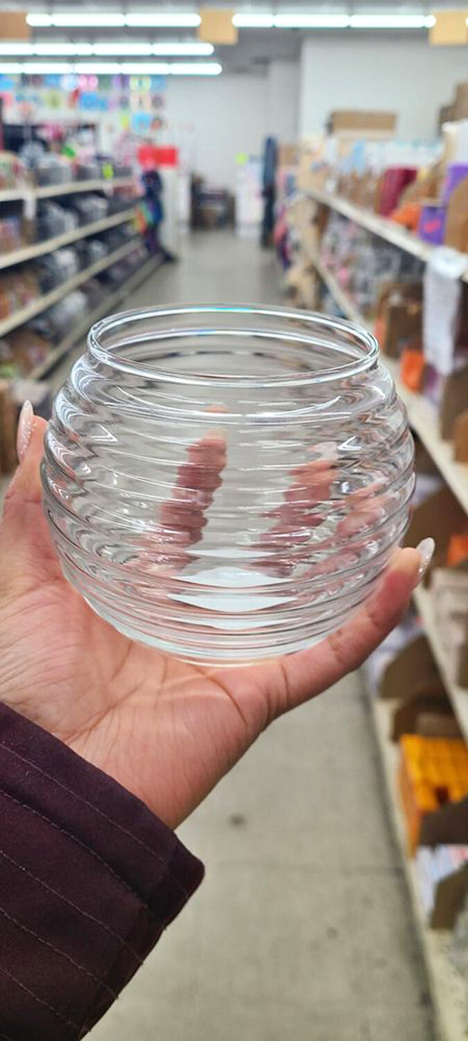 A perfectly rippled glass bowl catches the light and imagination. In fancy stores, this would be "artisanal"—here, it's just Tuesday's great find.