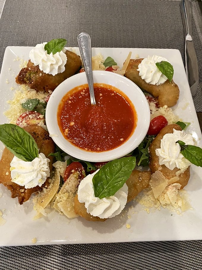 These aren't just appetizers—they're edible art. Crispy squash blossoms surrounding marinara like delicious satellites orbiting a tomato planet.