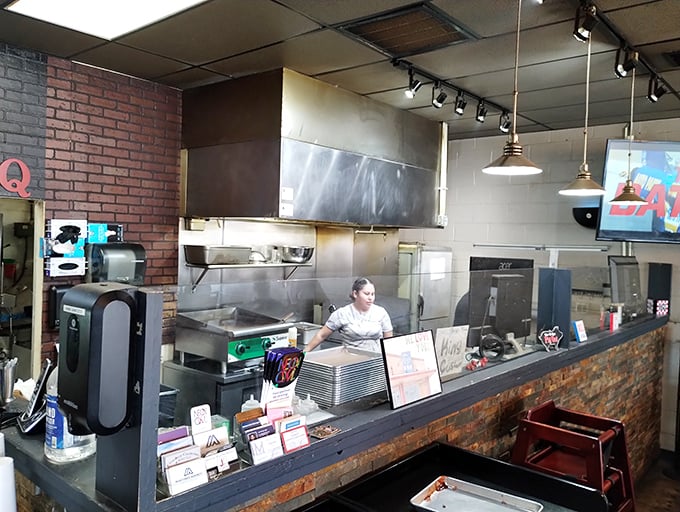 Where the magic happens – the pass between smoky creation and eager consumption. These folks are the unsung heroes of your food coma.
