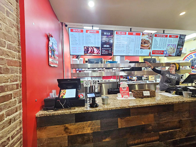 Behind that counter lies barbecue alchemy. The staff aren't just servers—they're gatekeepers to a smoky paradise where patience transforms tough cuts into tender treasures.