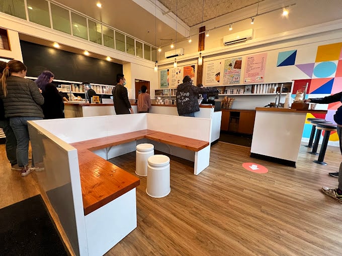 The calm before the flavor storm. Patrons line up with the patience of saints, knowing that paradise awaits just a few minutes away.