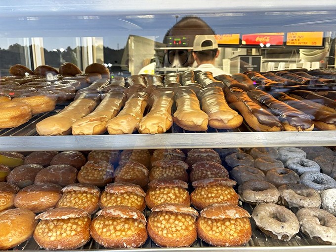 The display case—a museum of fried dough where every shelf tells a different delicious story worth the drive to Glendora.