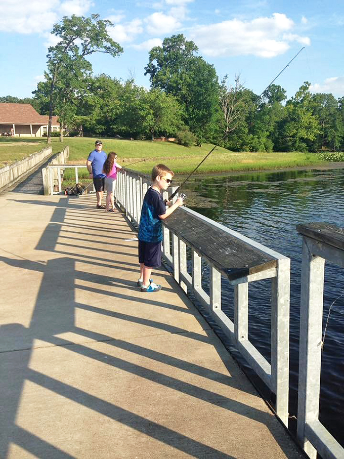 Fishing lessons and life lessons happening simultaneously. Three generations learning patience pays off – both with fish and with family.