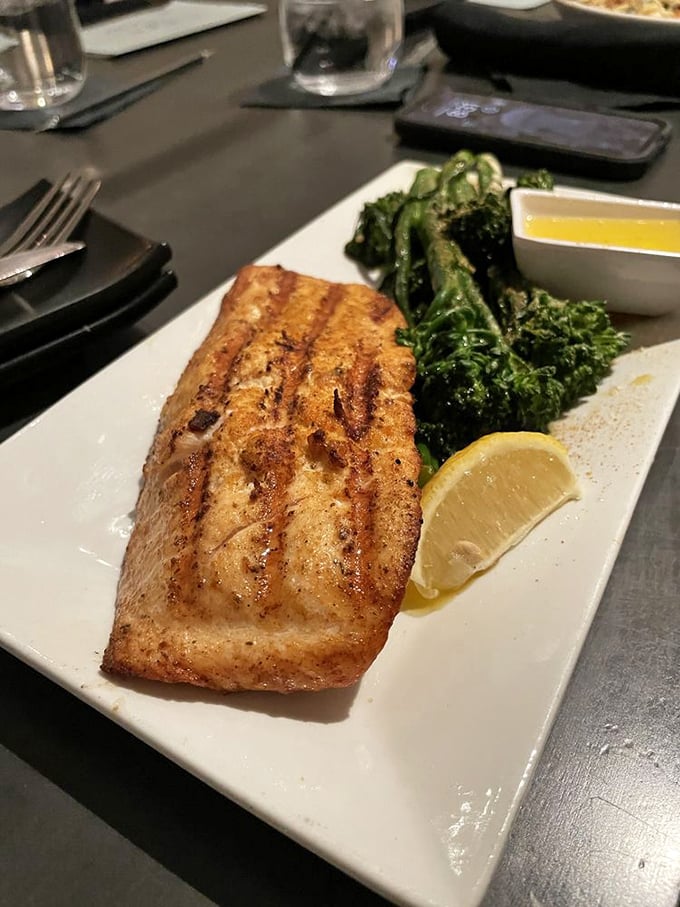 Salmon grilled with such precision it practically sparkles. Paired with vibrant broccolini and lemon—simplicity that showcases culinary confidence.