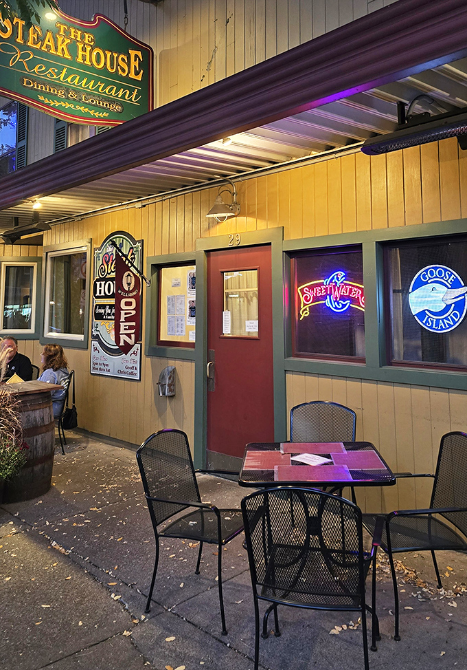 Outdoor seating for those who prefer their steak with a side of fresh Pennsylvania air. The neon glow says "come in, we're waiting for you." 