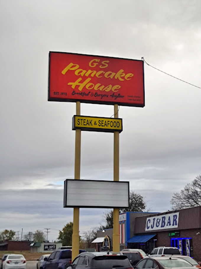 The sign promises "Breakfast & Burgers Anytime"—words that should be embroidered on a national flag of comfort.