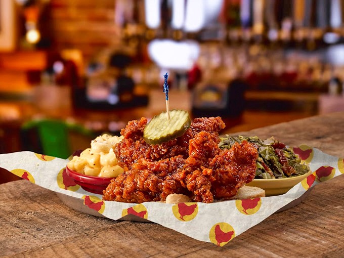 This isn't just fried chicken—it's a spice-dusted masterpiece where each tender morsel sits proudly alongside mac and cheese that's practically begging to cool your palate.