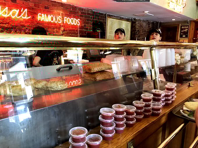 Behind the counter where sandwich magic happens daily—these folks could teach a master class in deli perfection.
