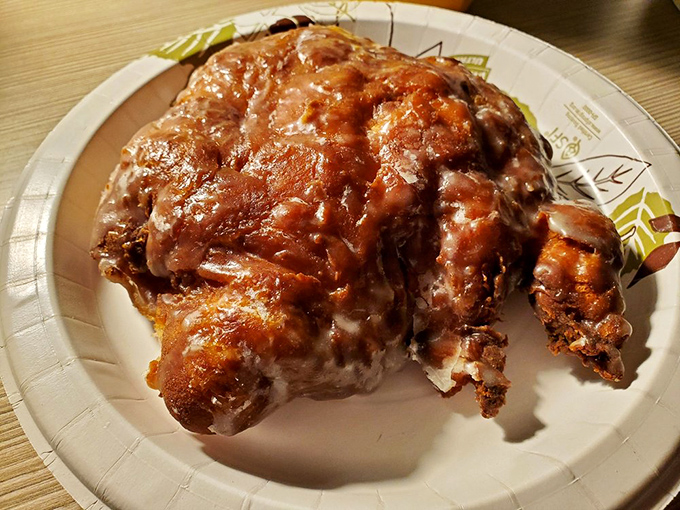 The apple fritter—an irregular masterpiece of apples and cinnamon—is like the jazz of pastries: improvised, soulful, and deeply satisfying.