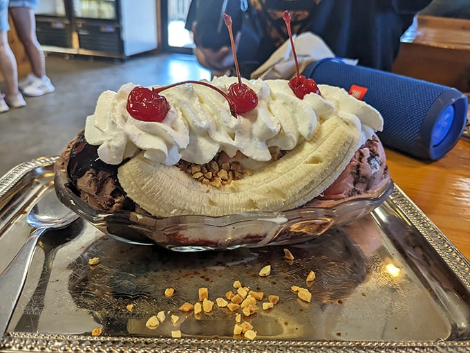 The banana split at Moomers isn't just dessert—it's architecture, sculpture, and performance art rolled into one glorious silver dish.