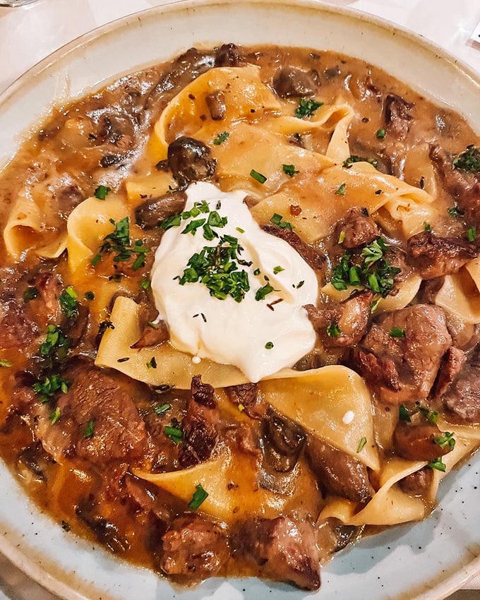 Beef Stroganoff elevated to art form—tender meat swimming in a sauce so rich it probably has its own accountant. Comfort food with a pedigree.