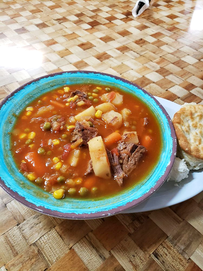 Beef stew in a vibrant turquoise bowl – hearty, honest food where each spoonful tells a story of slow-cooked tradition and careful seasoning.